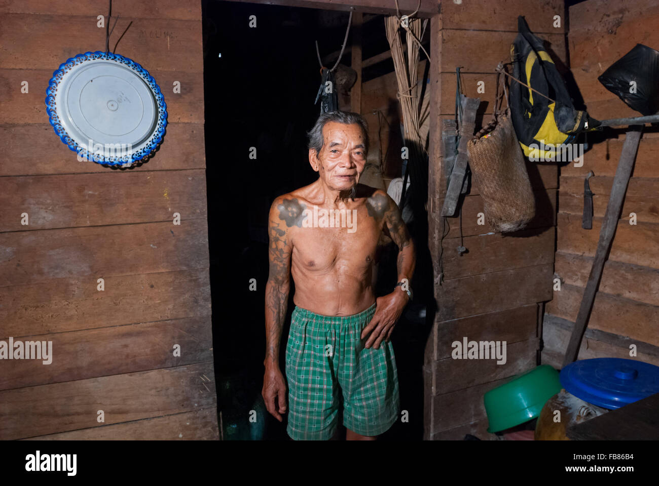 Portrait of Moling, the oldest person living in the longhouse of Dayak ...