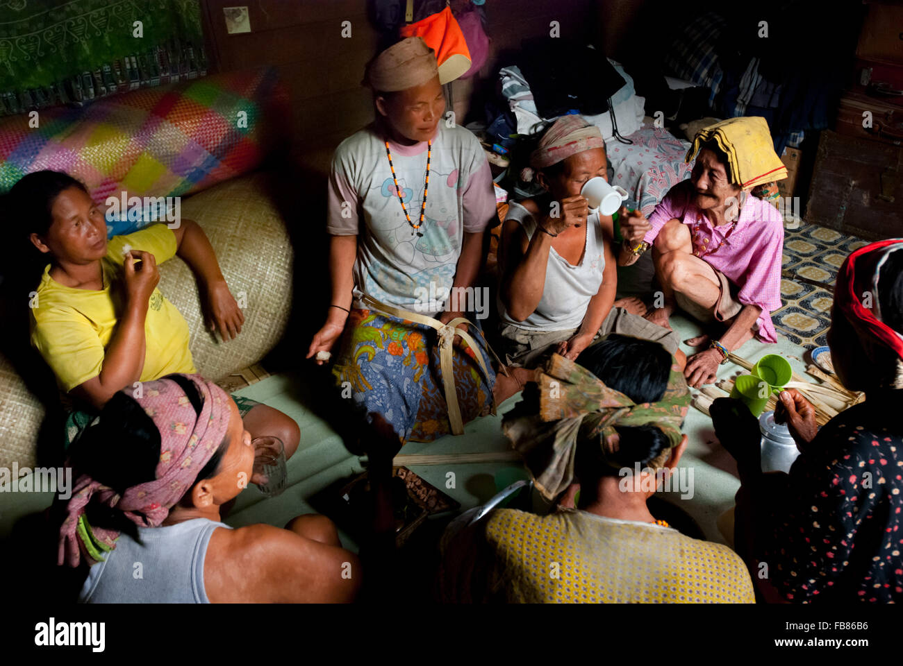 Dayak women of sub-ethnic group of Tamambaloh Apalin drinking palm wine ...