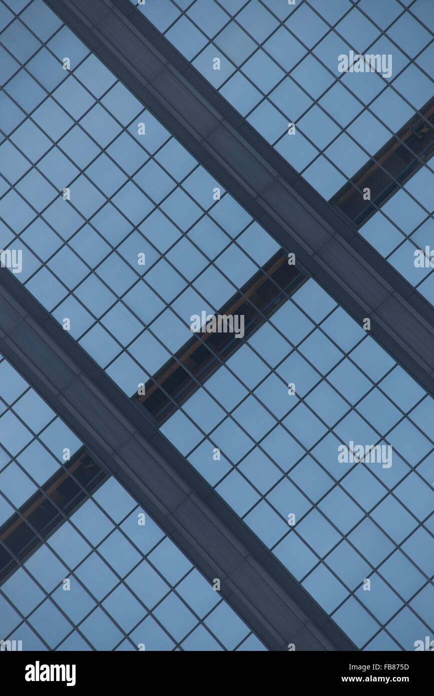 Angled view of blue glass building facade Stock Photo - Alamy