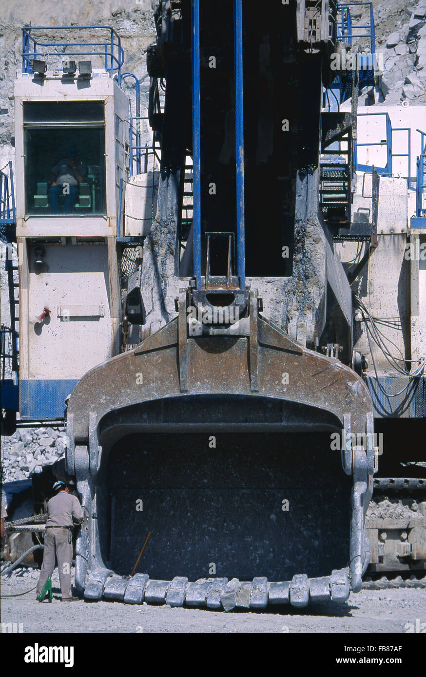 A mechanic works on a mammoth ore excavator at the Cyprus Sierrita ...