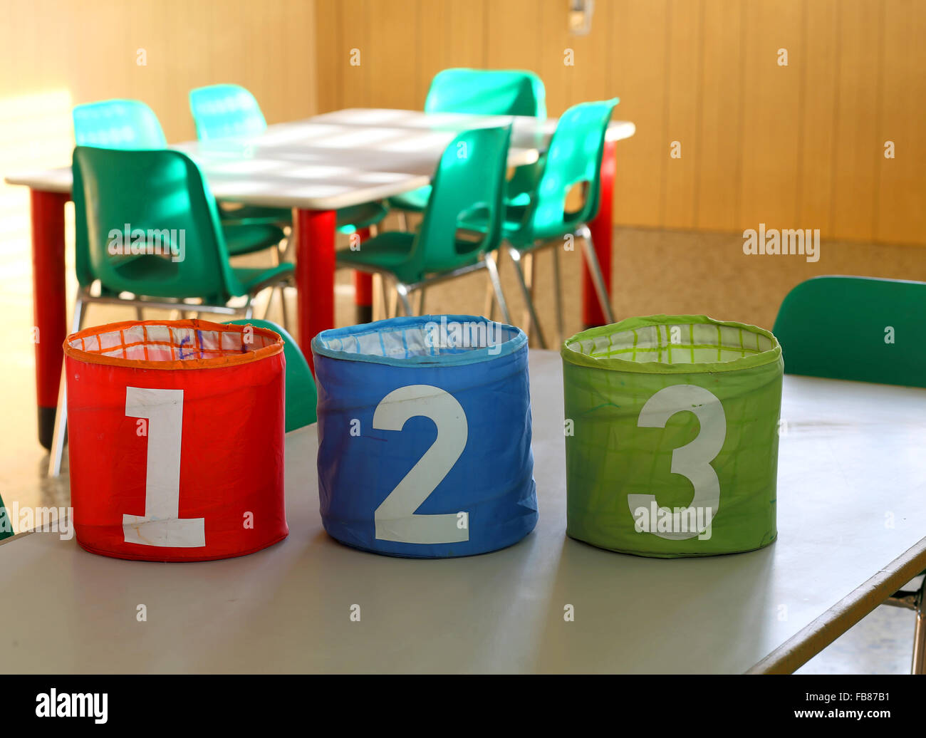 cans with large numbers on the desk in the kindergarten Stock Photo - Alamy