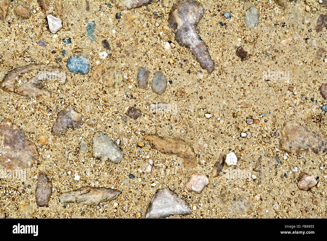 Texture of yellow sand and pebbles of colored granite Stock Photo - Alamy