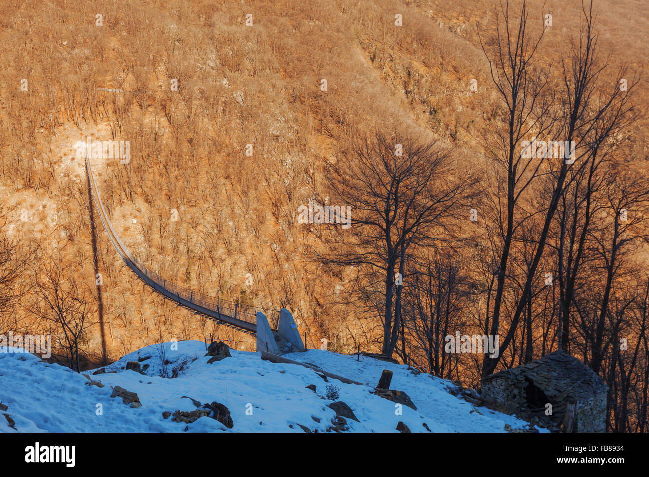 Mountain landscape with suspension bridge over the valley Stock Photo ...