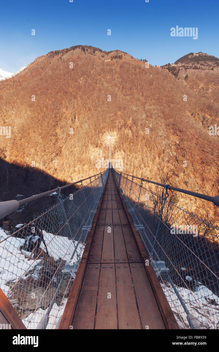 Mountain landscape with suspension bridge over the valley Stock Photo ...