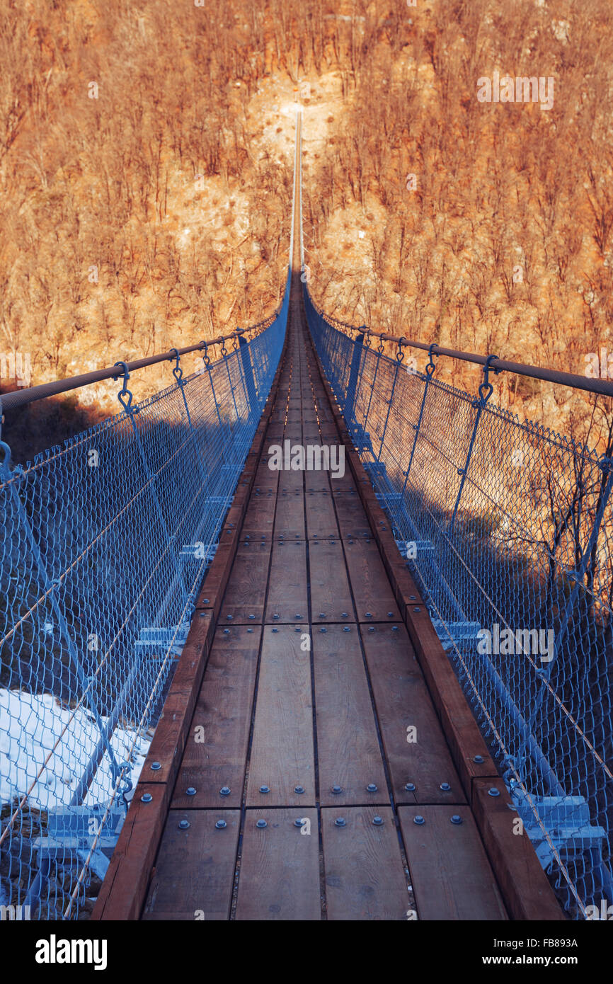 Mountain landscape with suspension bridge over the valley Stock Photo ...