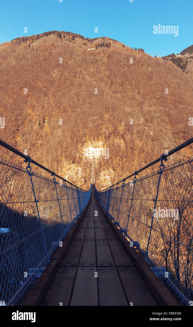 Mountain landscape with suspension bridge over the valley Stock Photo ...