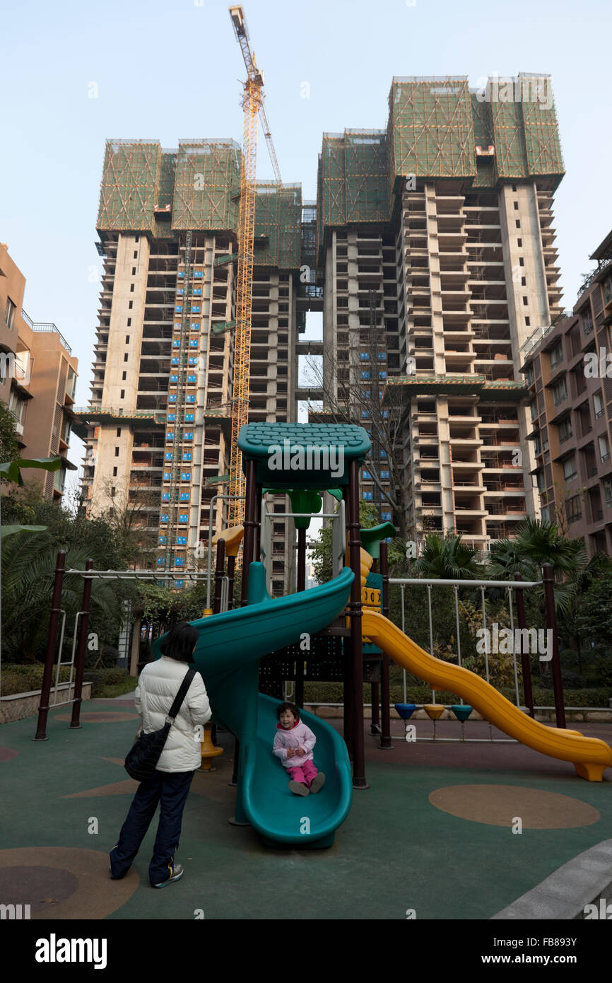 A toddler plays at the playground of a gated community while the ...