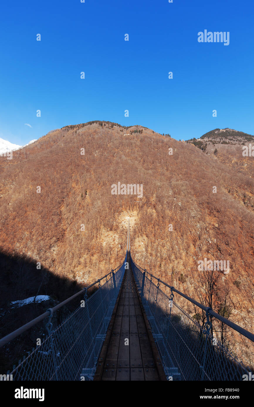 Mountain landscape with suspension bridge over the valley Stock Photo ...