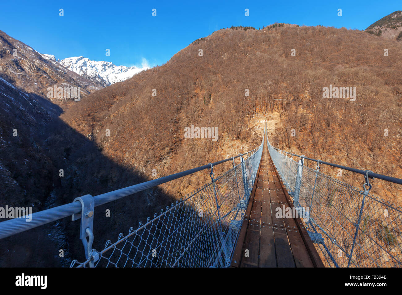 Mountain landscape with suspension bridge over the valley Stock Photo ...