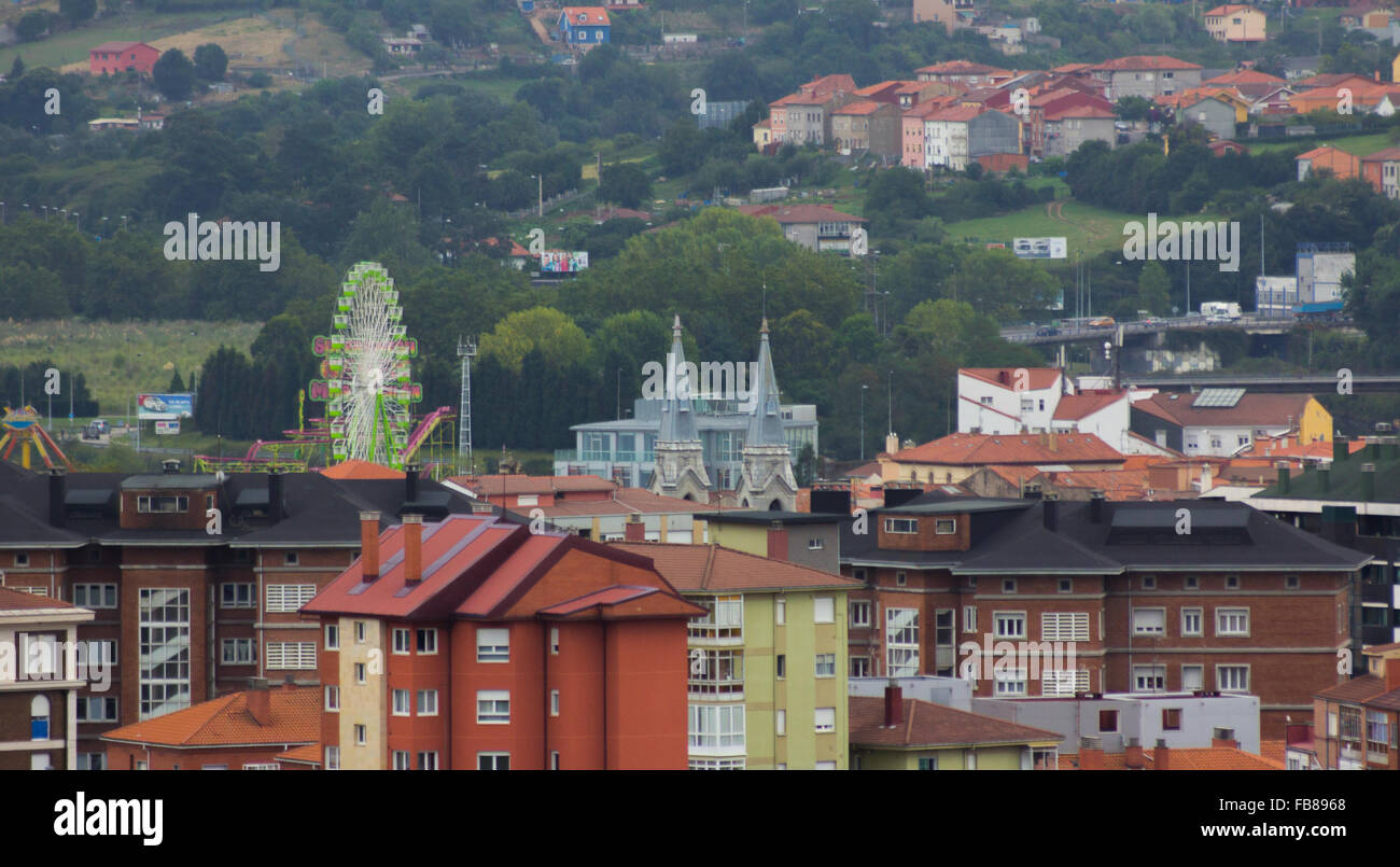 Overview and ferris wheel in the city of Aviles, Spain Stock Photo - Alamy