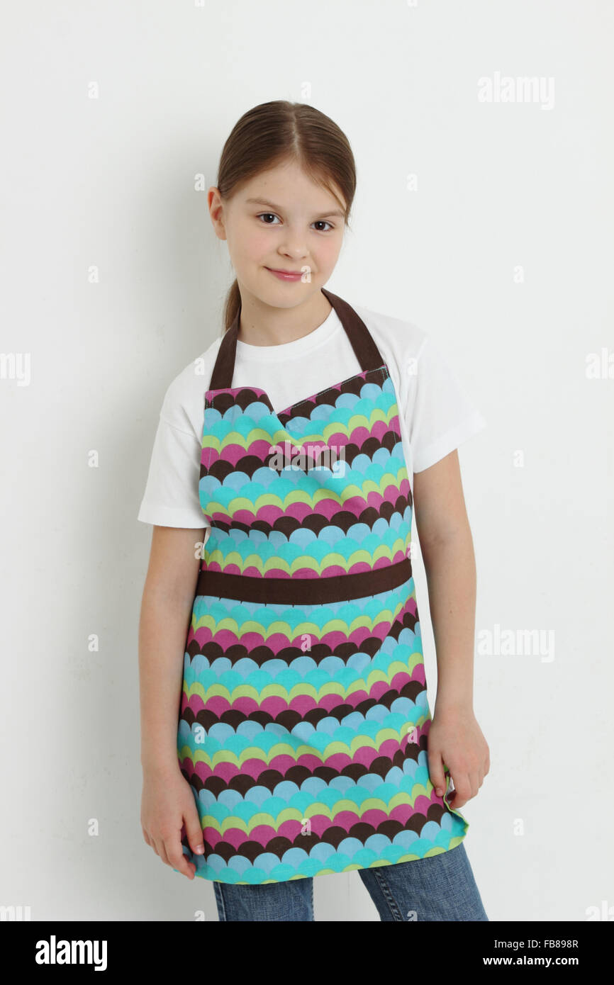 Kid wearing colorful apron Stock Photo - Alamy