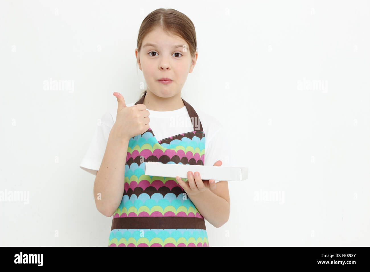 Teen girl eating sweet paste Stock Photo - Alamy