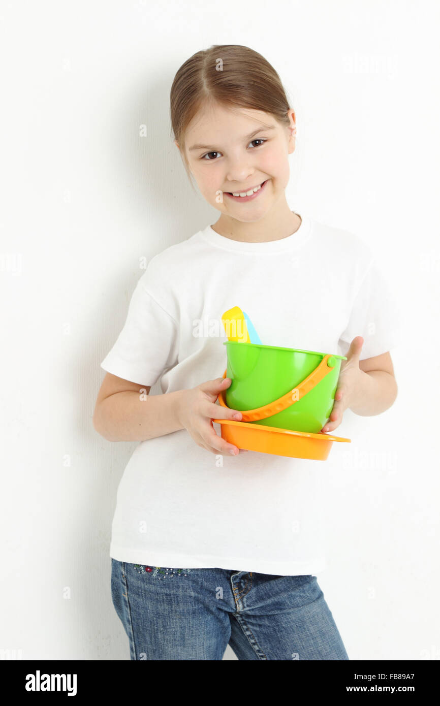 Child holding bucket and sand hi-res stock photography and images - Alamy
