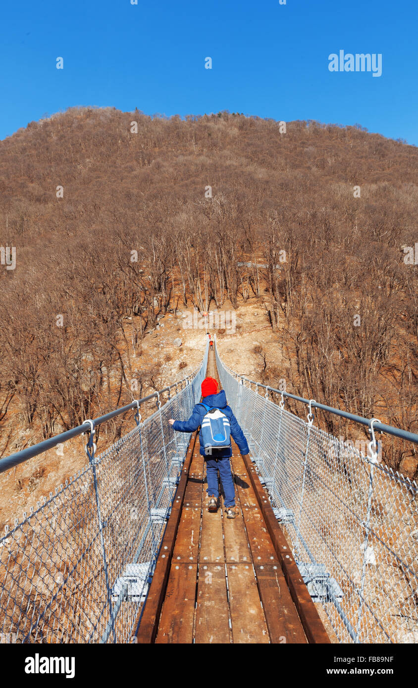 Mountain landscape with suspension bridge over the valley Stock Photo ...