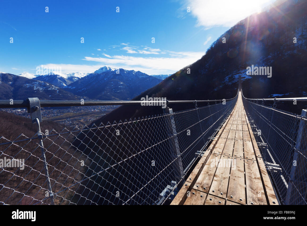Mountain landscape with suspension bridge over the valley Stock Photo ...