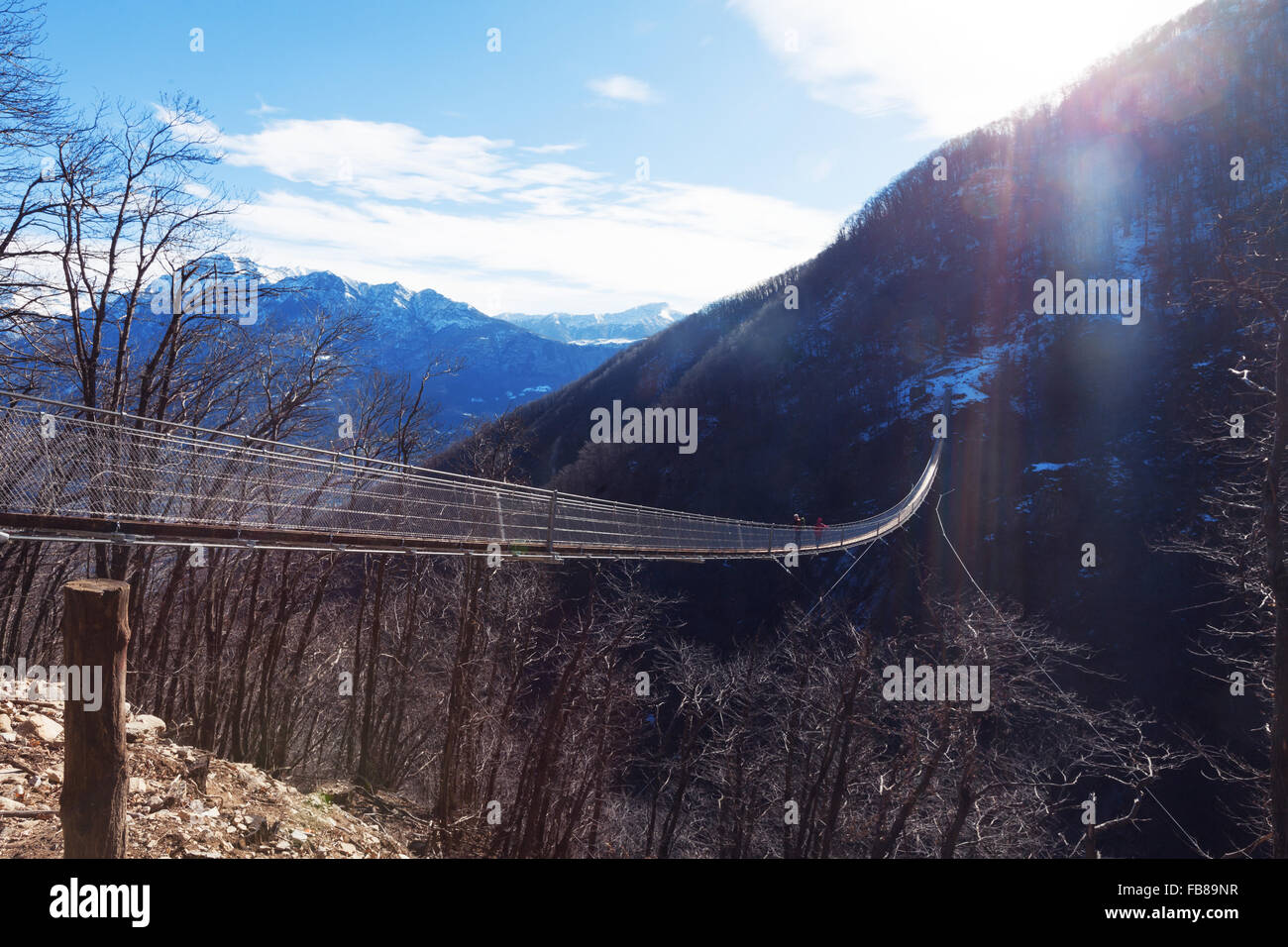 Mountain landscape with suspension bridge over the valley Stock Photo ...