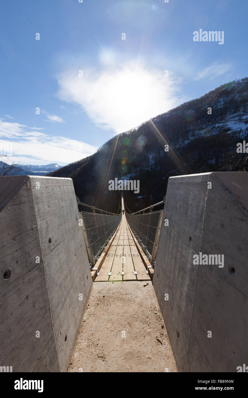 Mountain landscape with suspension bridge over the valley Stock Photo ...