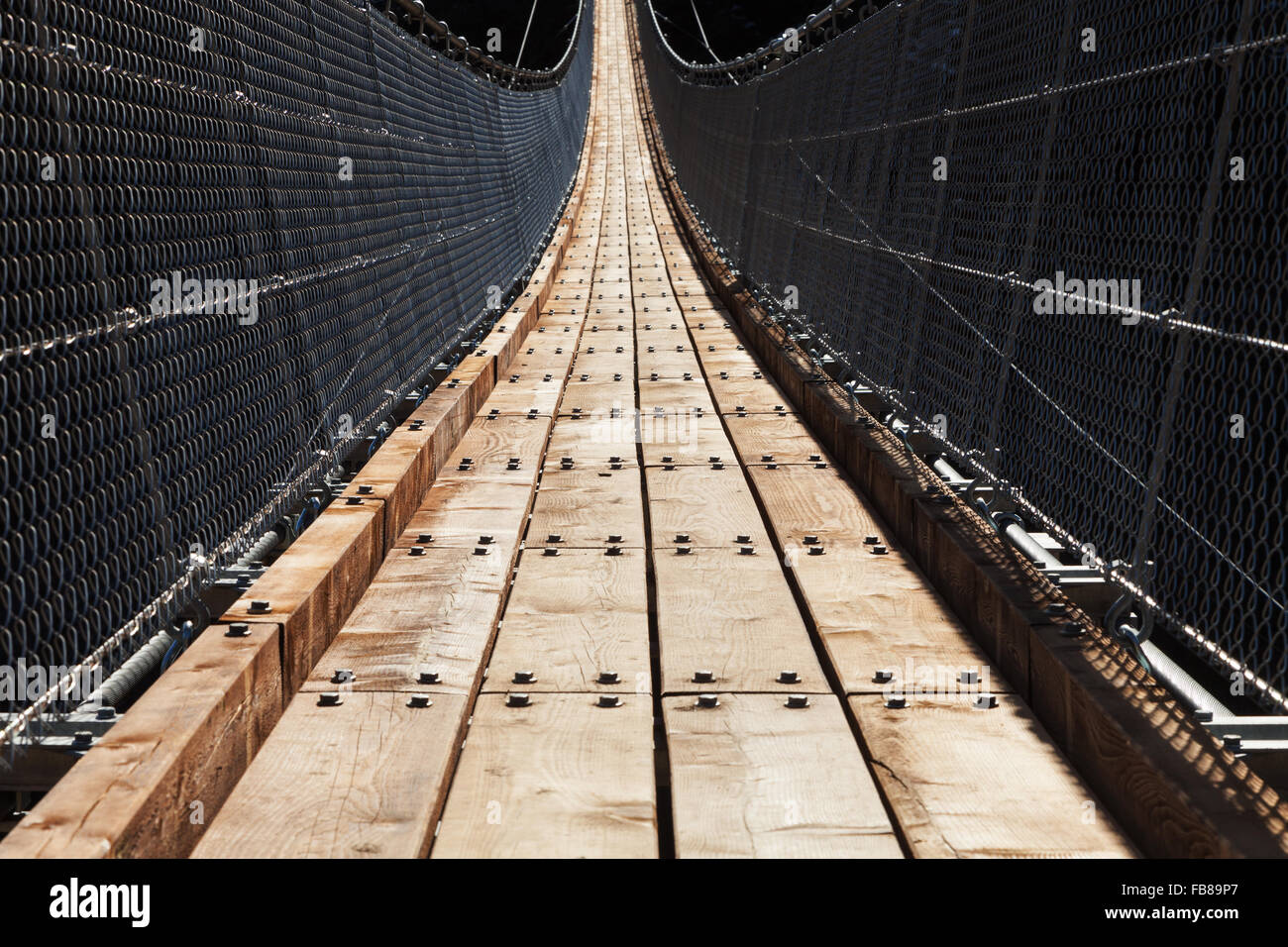 Suspension bridge over the valley Stock Photo - Alamy
