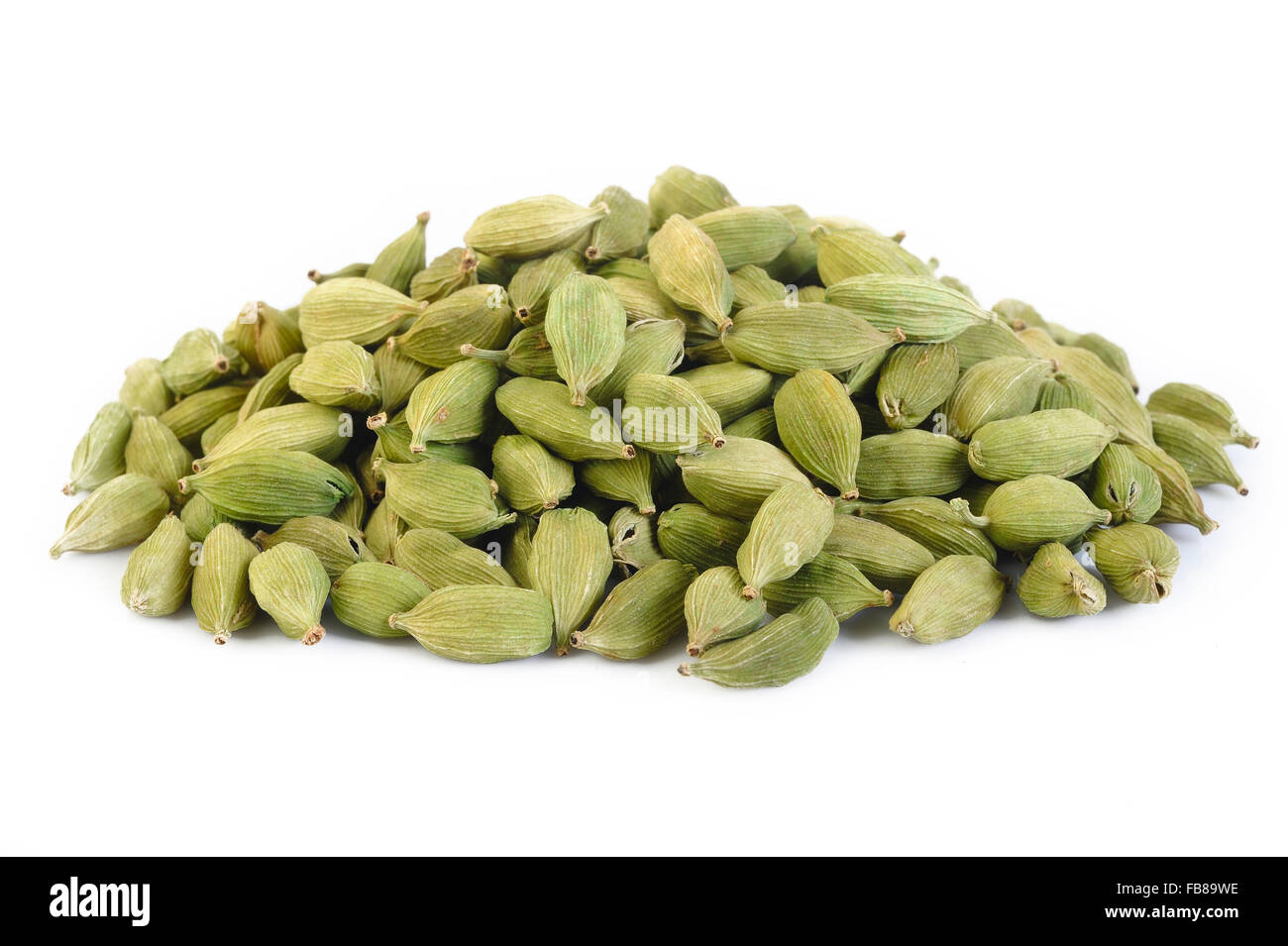 cardamon pods on white background Stock Photo - Alamy