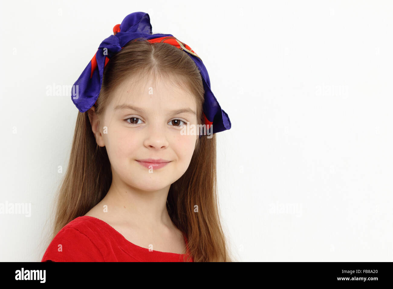Smiley happy little lady in red Stock Photo - Alamy