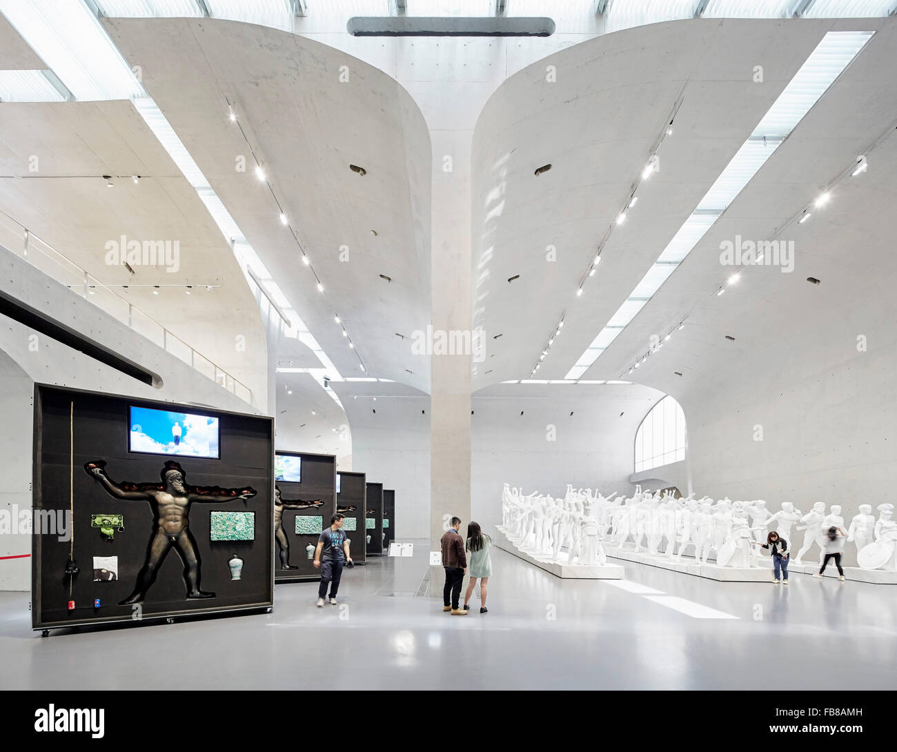 Ground floor exhibition area with narrow skylights. Long Museum West ...