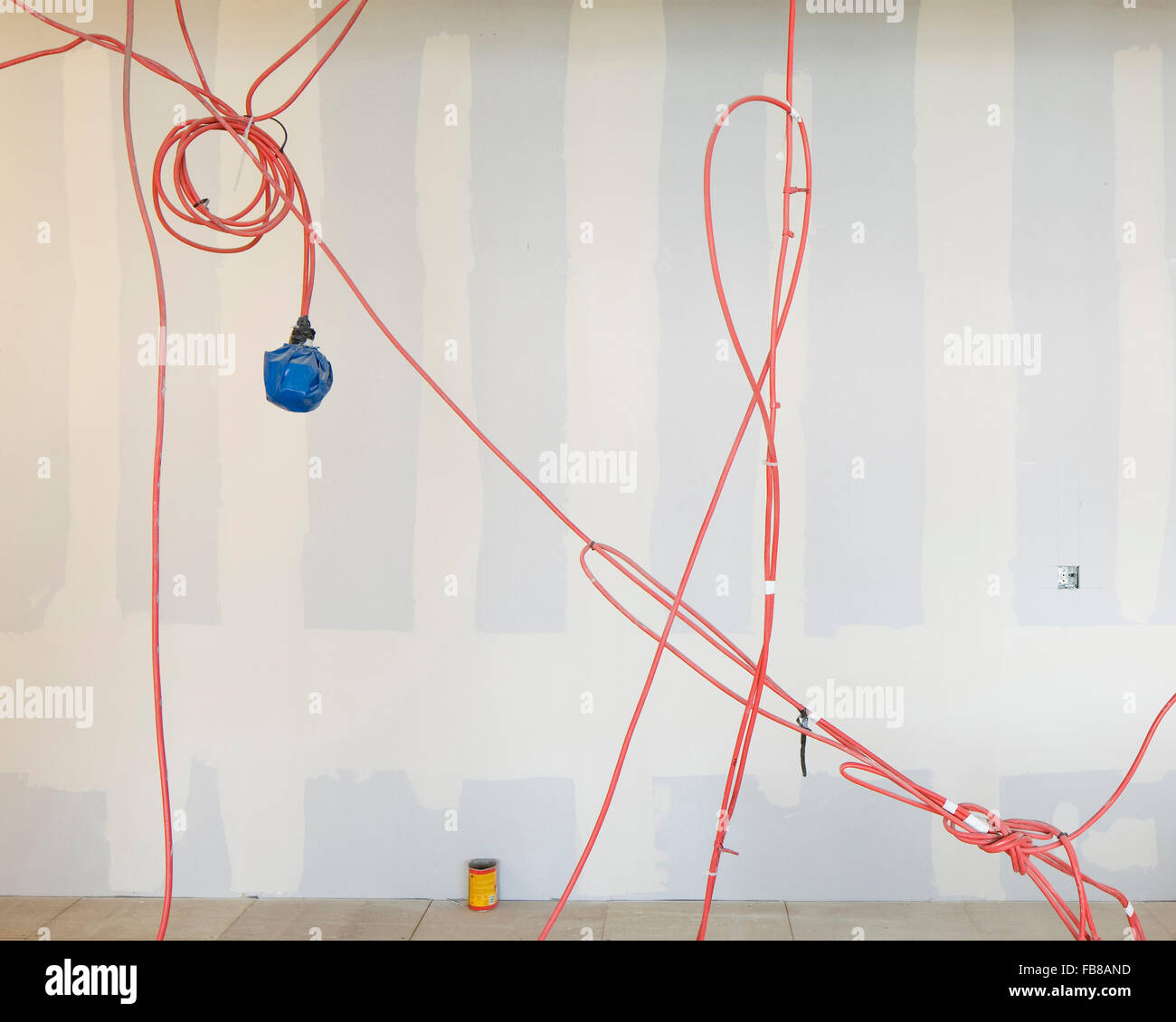 Red cables, construction site detail. Cockcroft Building, University of ...