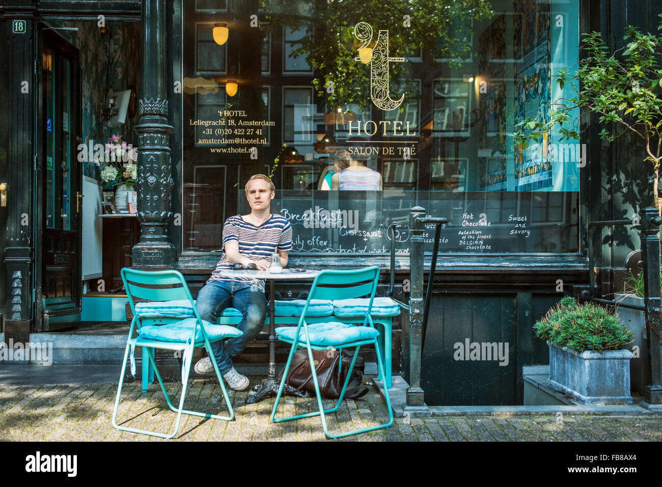 Man sitting outside hi-res stock photography and images - Alamy