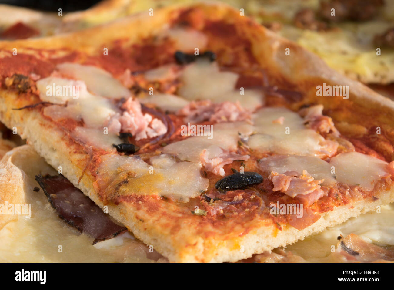 variety of homemade pizza cut in small pieces Stock Photo - Alamy