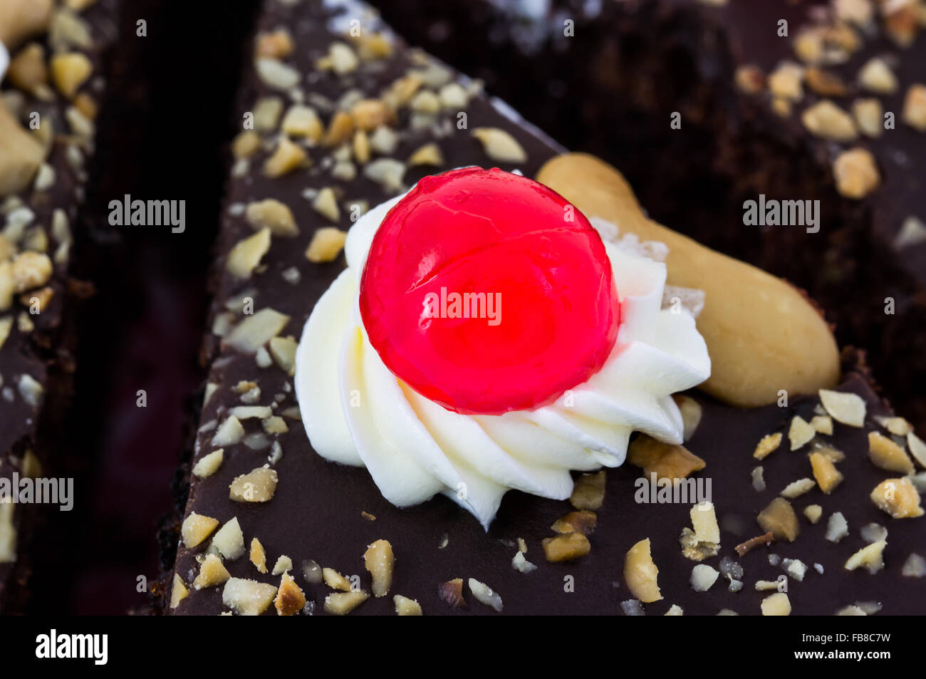 Closeup chocolate cake with red round jelly topping Stock Photo - Alamy