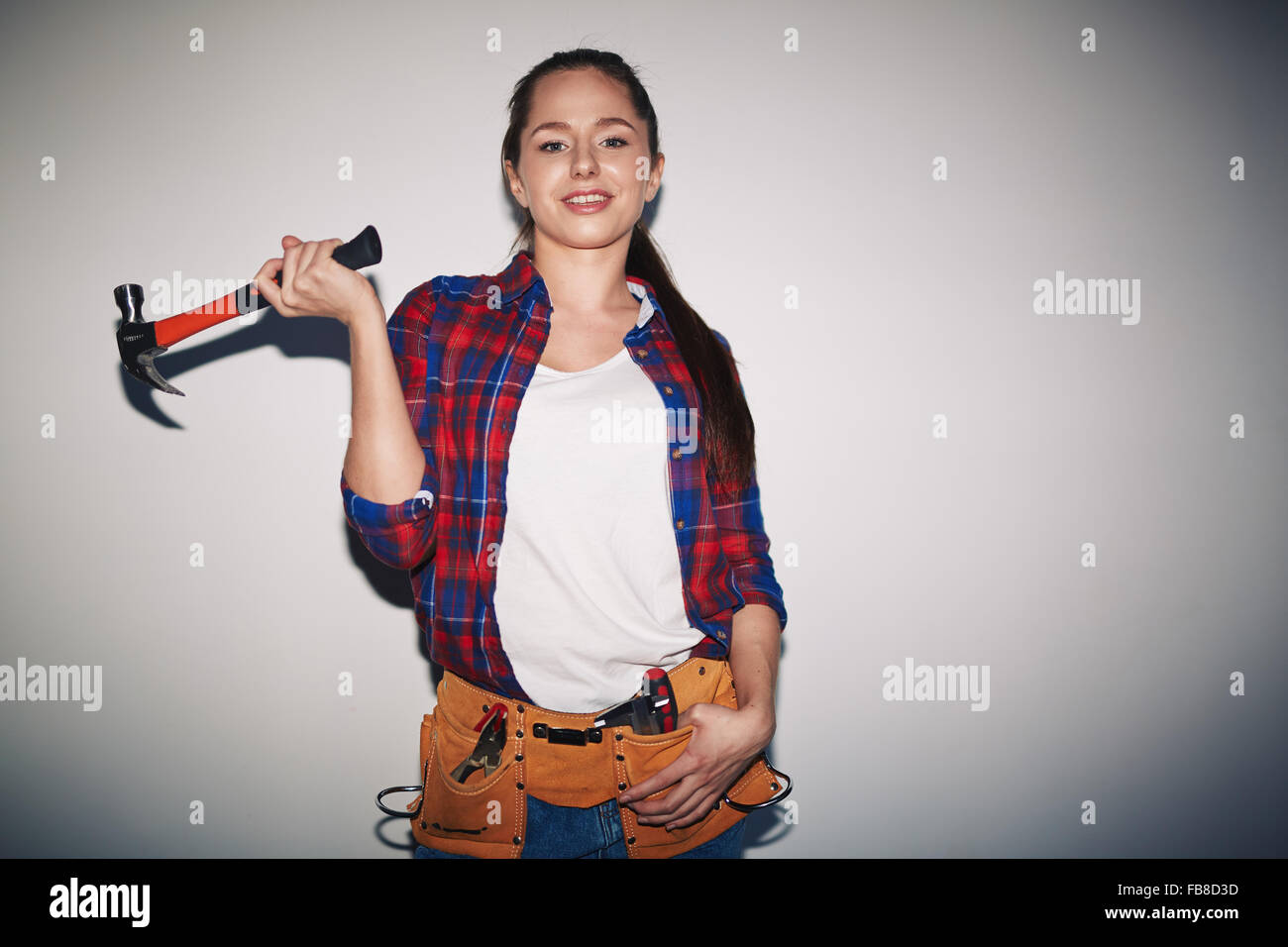 Young woman repairing camera hi-res stock photography and images - Alamy