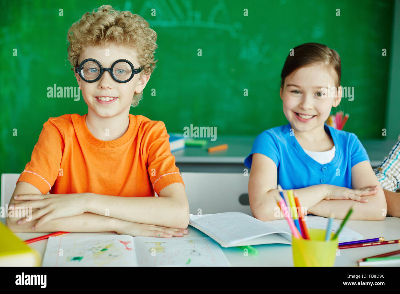 Children sitting at desk in school classroom Stock Photo - Alamy