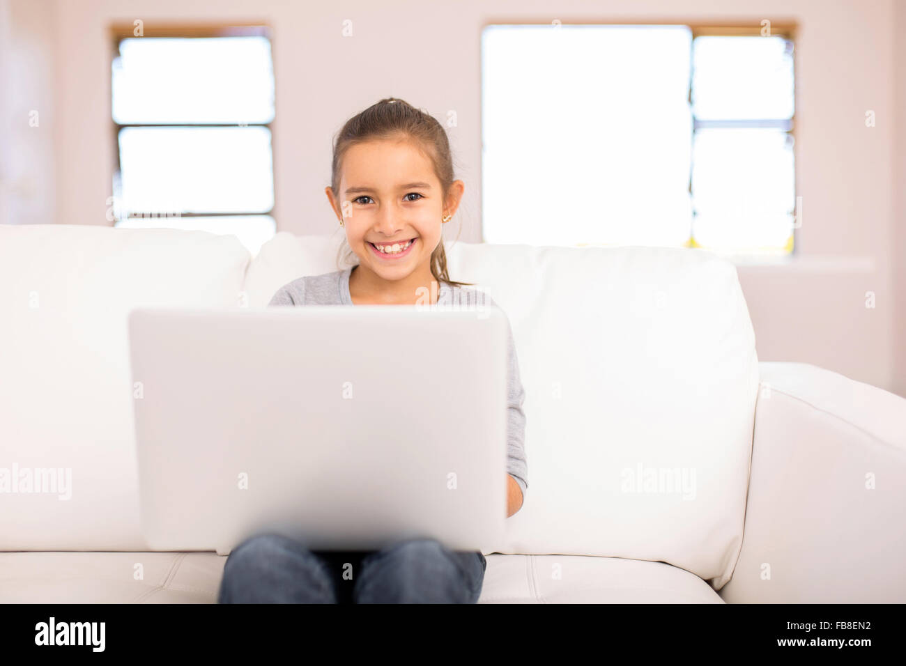 beautiful girl using laptop computer at home Stock Photo - Alamy