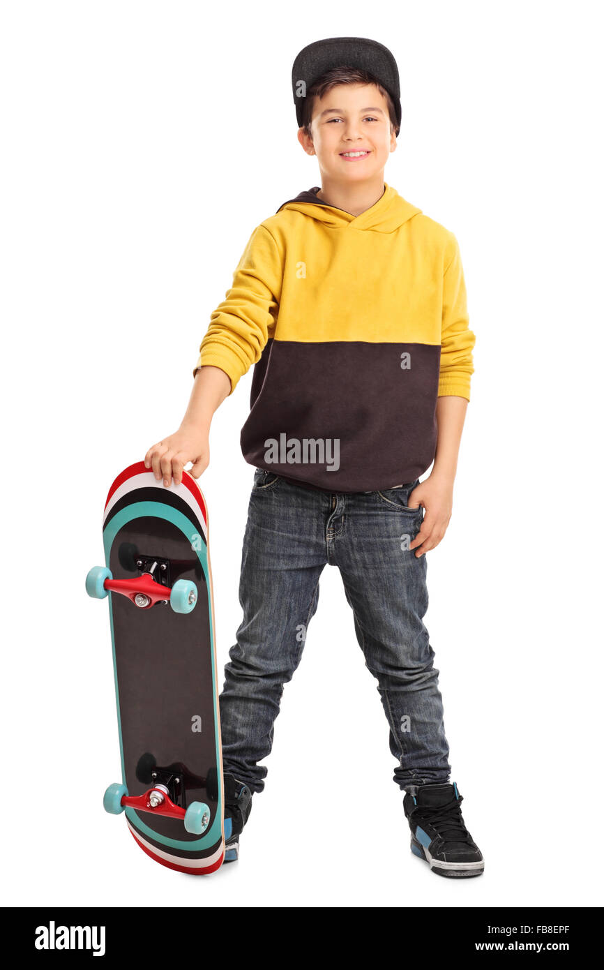 Full length portrait of a cute little skater boy holding a skateboard ...