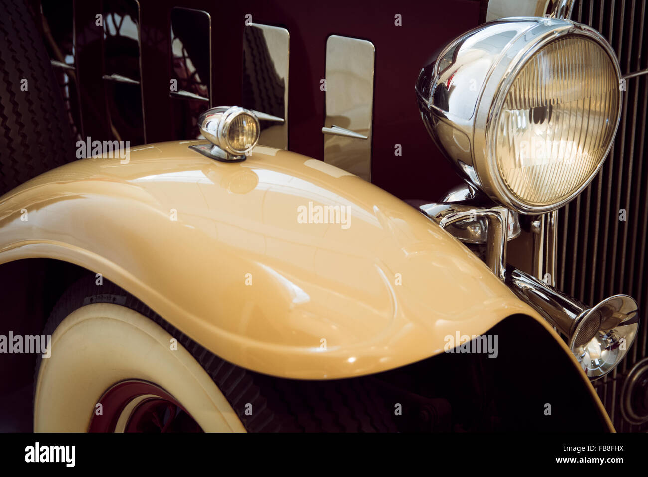 cropped image of front of old car including tyre and headlights Stock ...