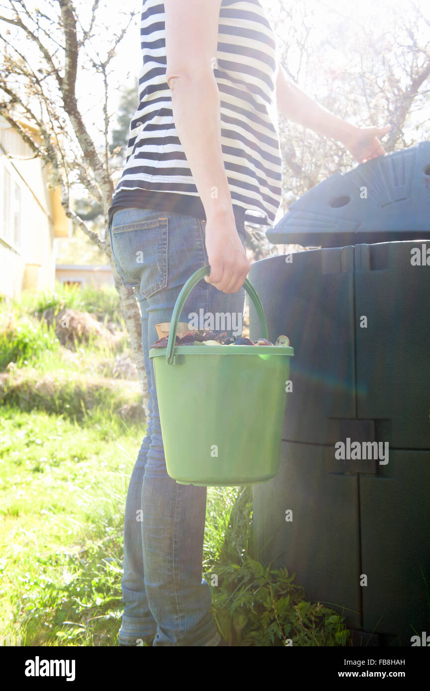 Woman throwing garbage home outside hi-res stock photography and images ...