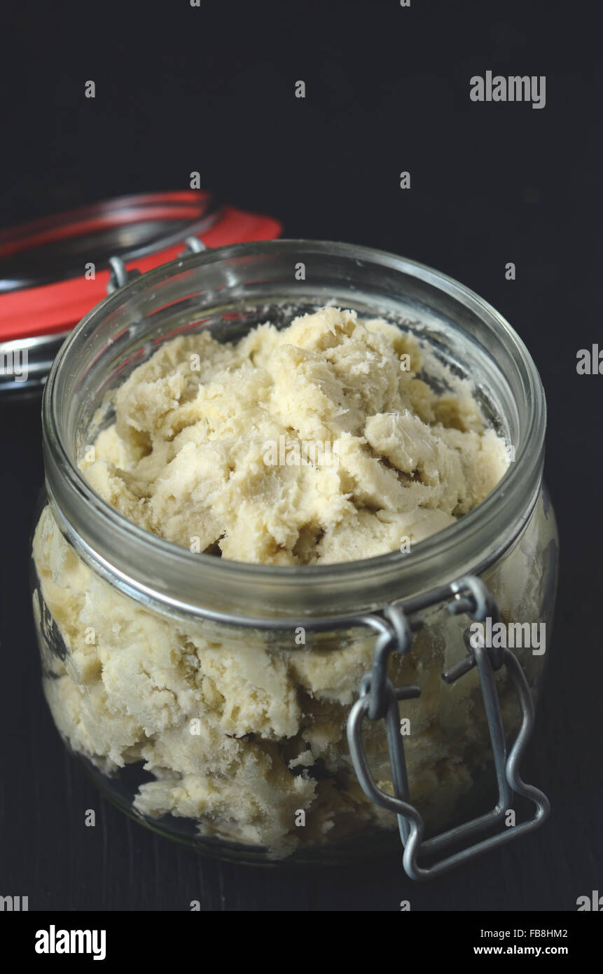 Unrefined raw shea butter on wooden background Stock Photo - Alamy