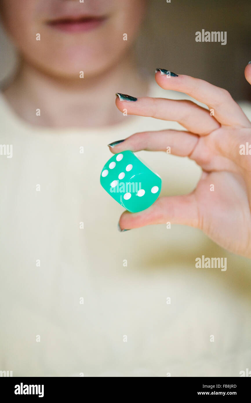 Human hand holding dice hi-res stock photography and images - Alamy