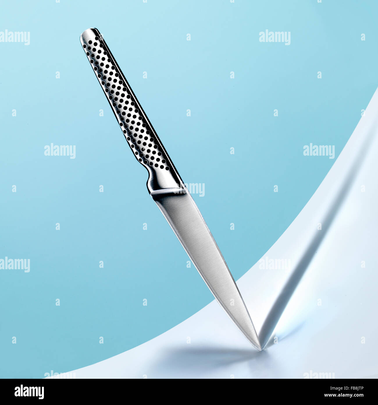 Chrome precision knife on curved white background Stock Photo - Alamy Chrome precision knife on curved white background Stock Photo - Alamy