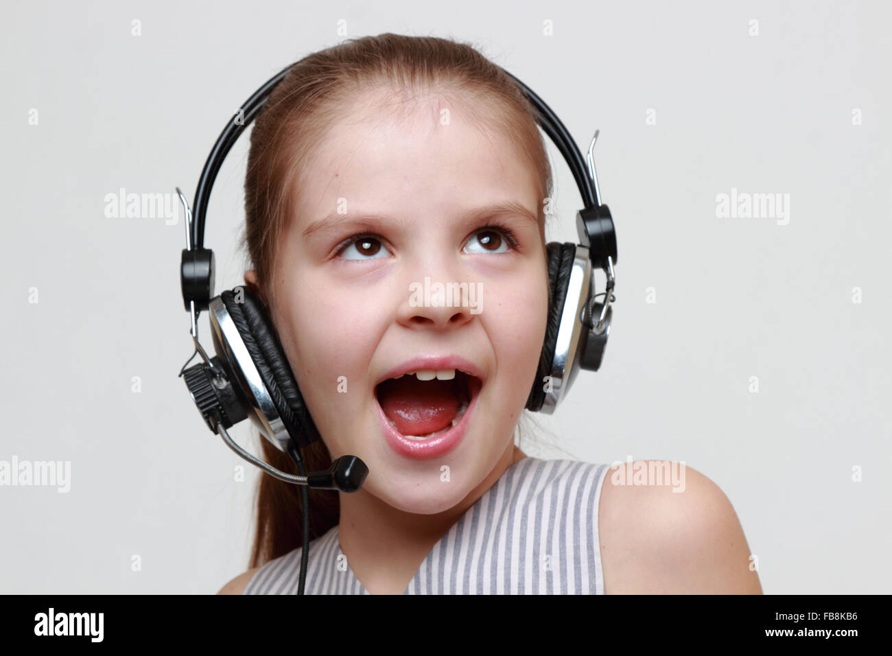 Lovely beautiful kid singing Stock Photo - Alamy