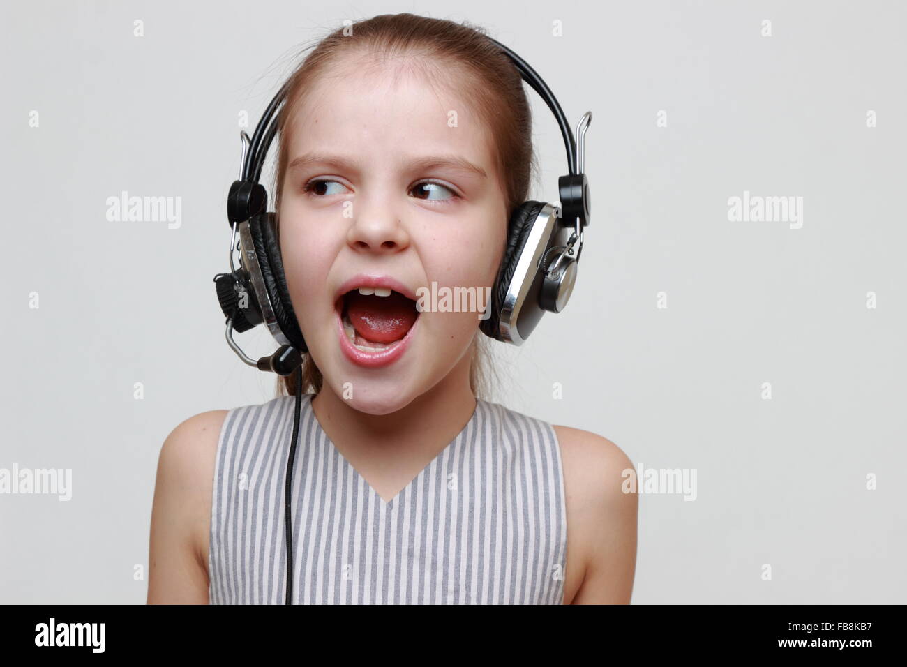 Lovely beautiful kid singing Stock Photo - Alamy