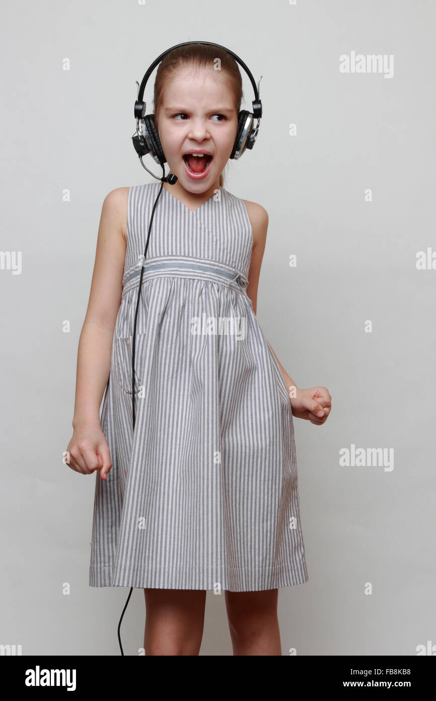 Lovely beautiful Kid singing Stock Photo - Alamy