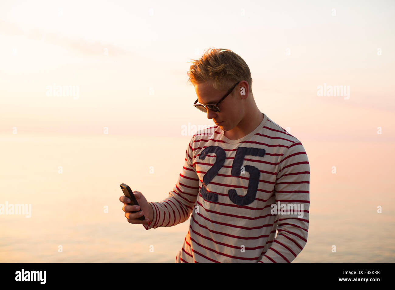 Old man standing at sunset hi-res stock photography and images - Alamy
