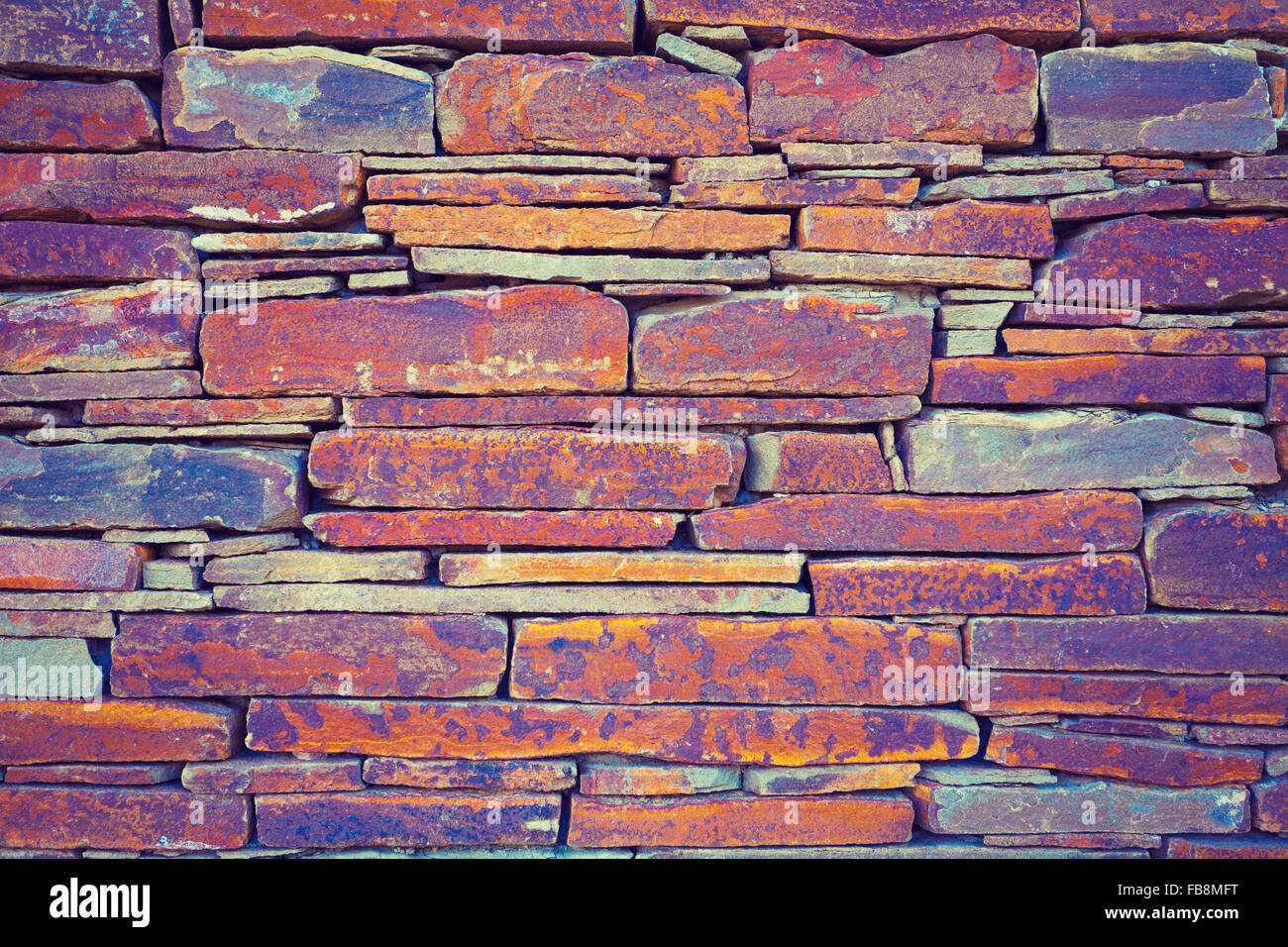 Grunge vintage wall of stone tiles Stock Photo - Alamy