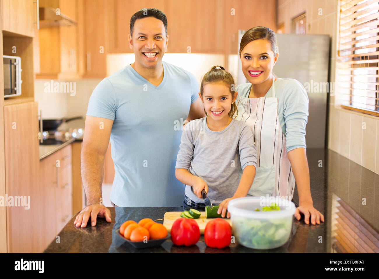 beautiful family cooking together in kitchen at home Stock Photo - Alamy