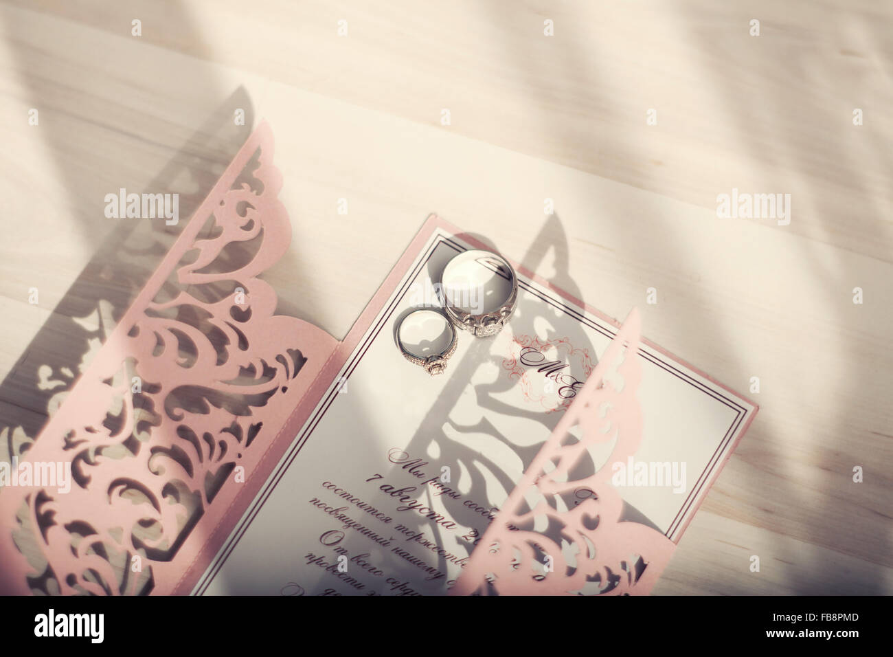 wedding silver rings and invitation Stock Photo - Alamy