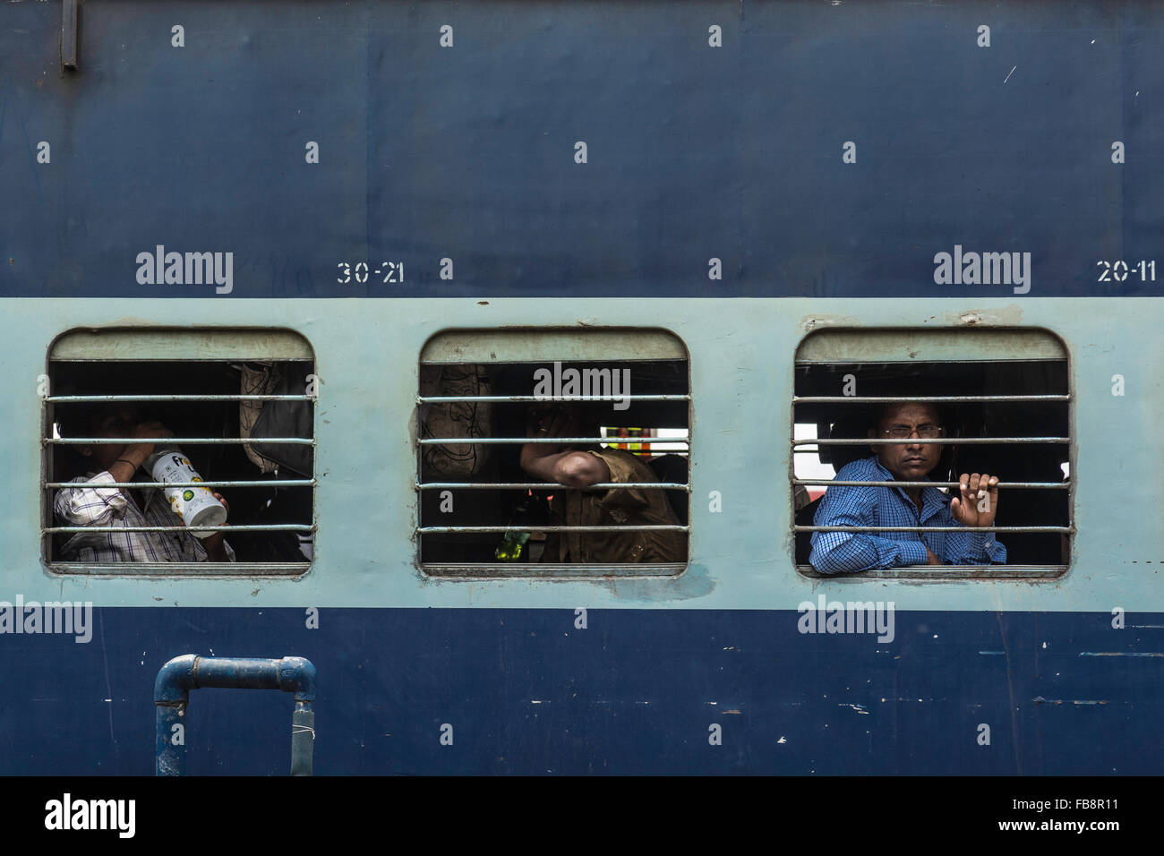 Looking out of doors or windows. Indian Railways, India Stock Photo - Alamy