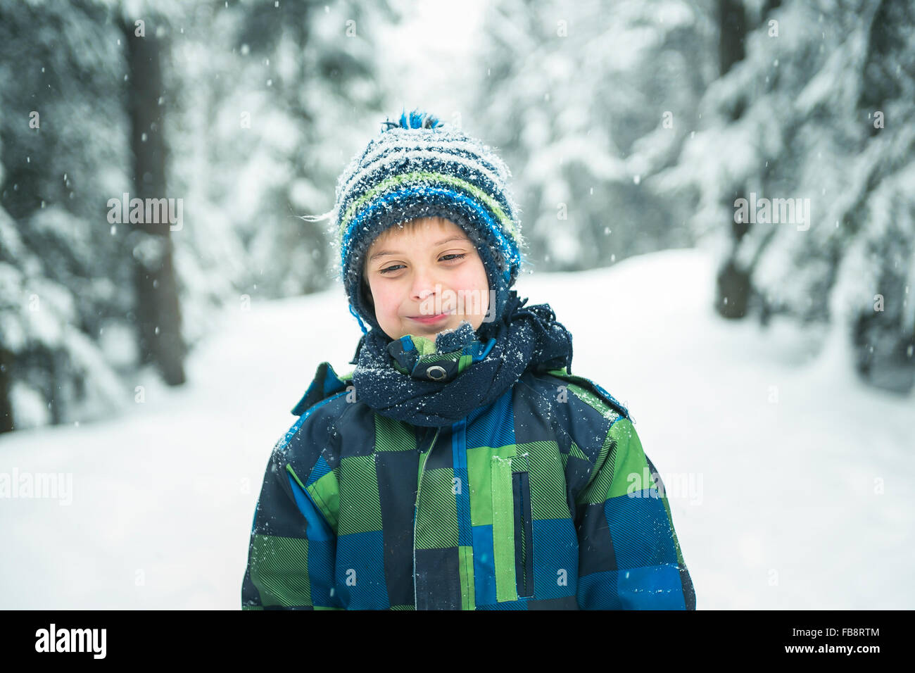Little boy Playing with Snow Outdoors in Winter Stock Photo - Alamy