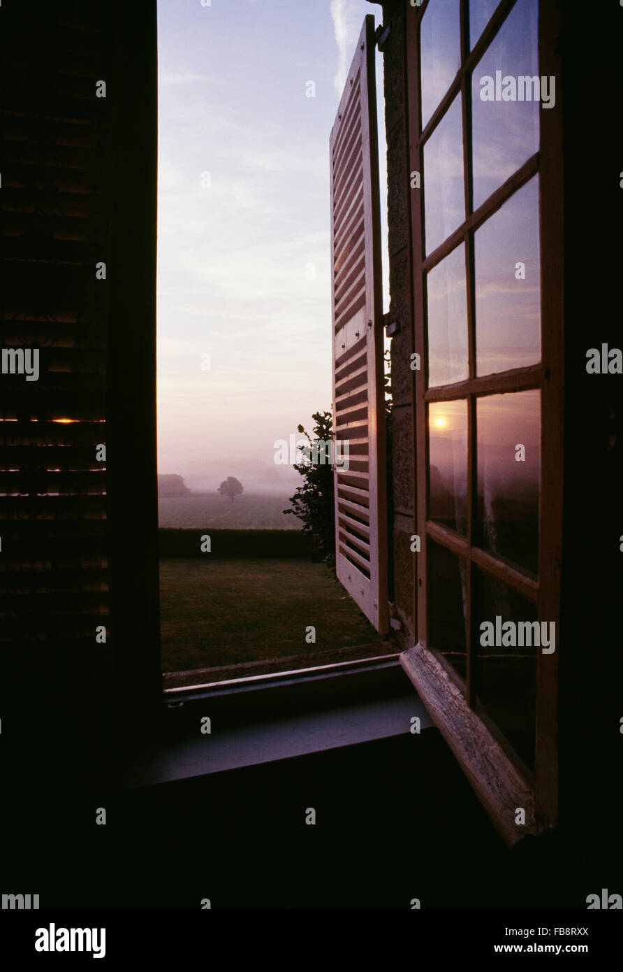 Sunset reflected on window grass Stock Photo - Alamy