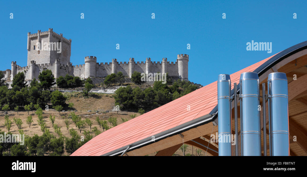 New modern building against old spanish castle Stock Photo - Alamy