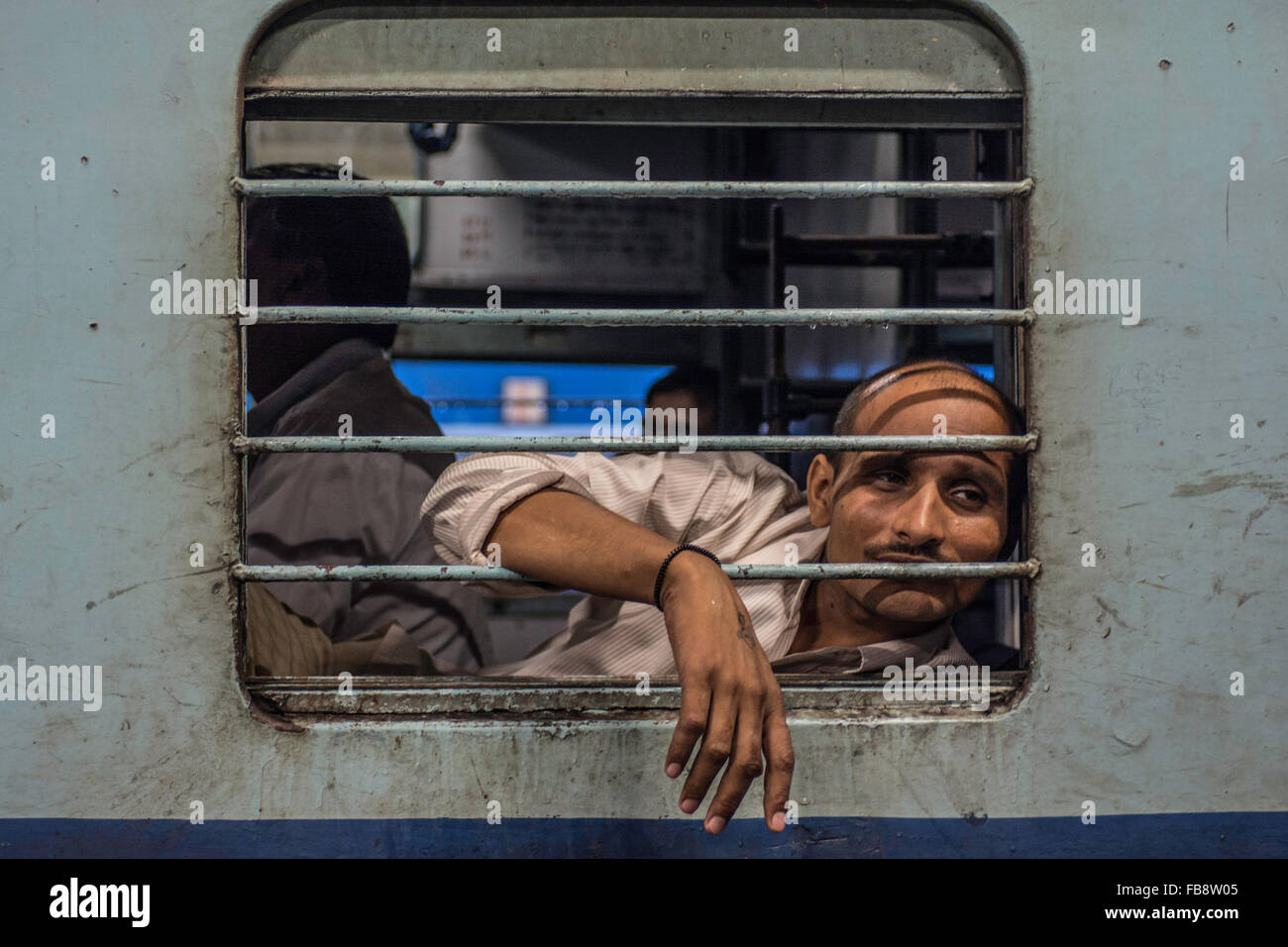 Looking out of doors or windows. Indian Railways, India Stock Photo - Alamy